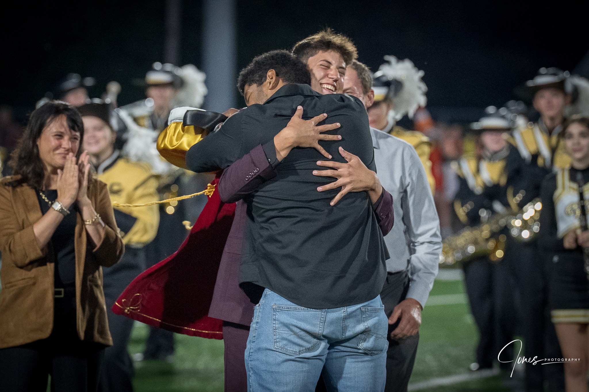 Sibling Spirit Shines as Homecoming King Passes Crown to Brother